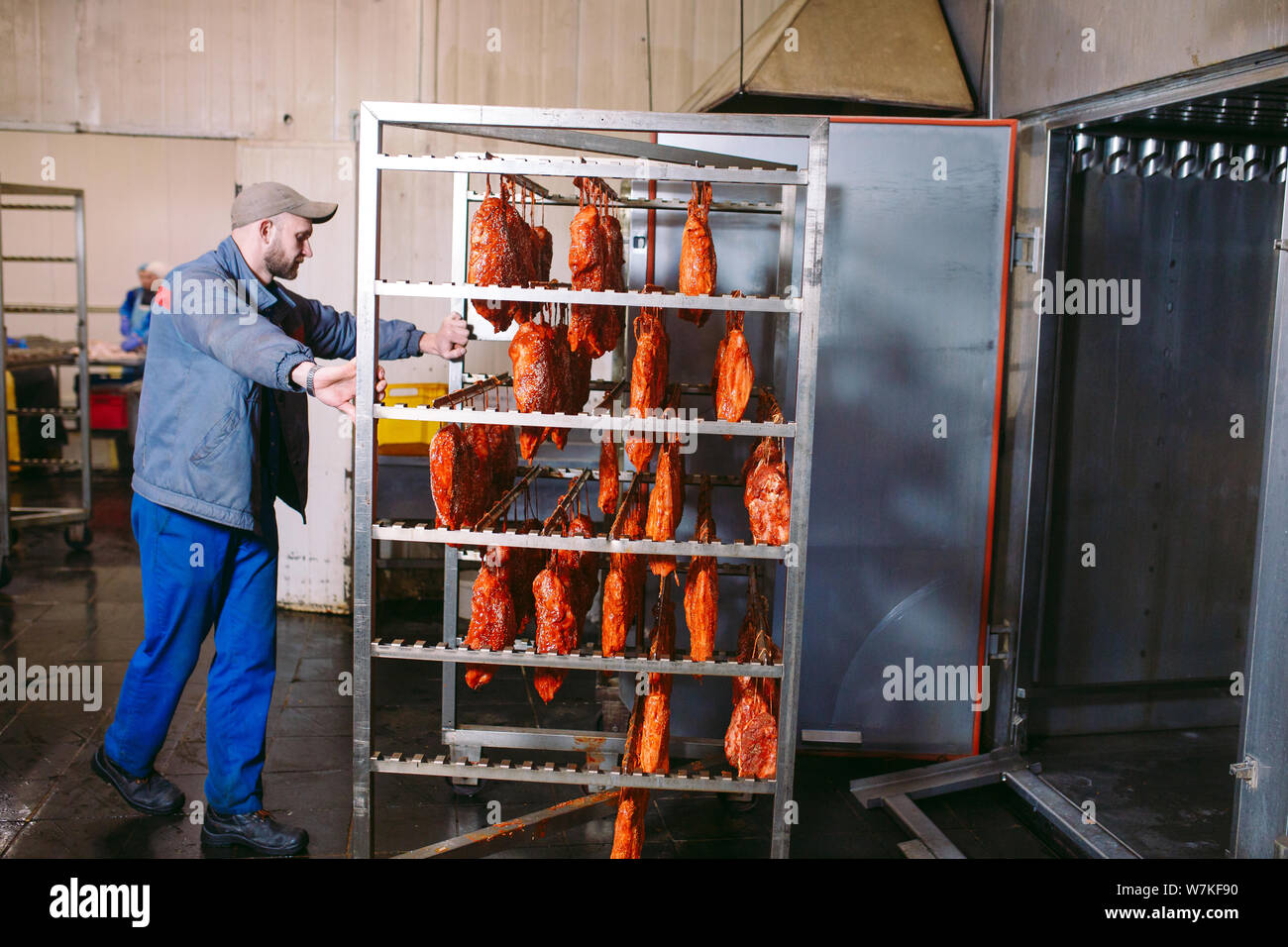 Smoked ham in the oven. Sausage production in the factory Stock Photo ...
