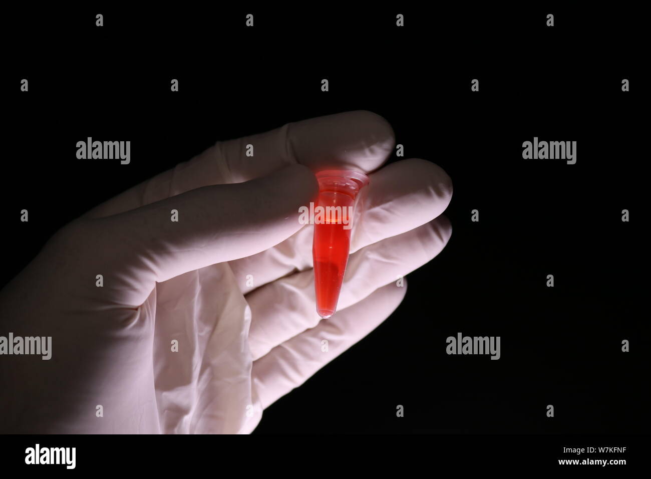Scientist holding vial with medical sample in laboratory Stock Photo ...