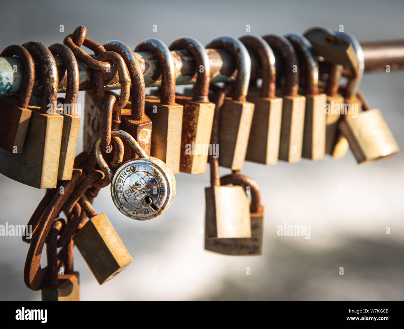 Group of Lovers padlocks tied on a bridge. Young people promise to lock ...