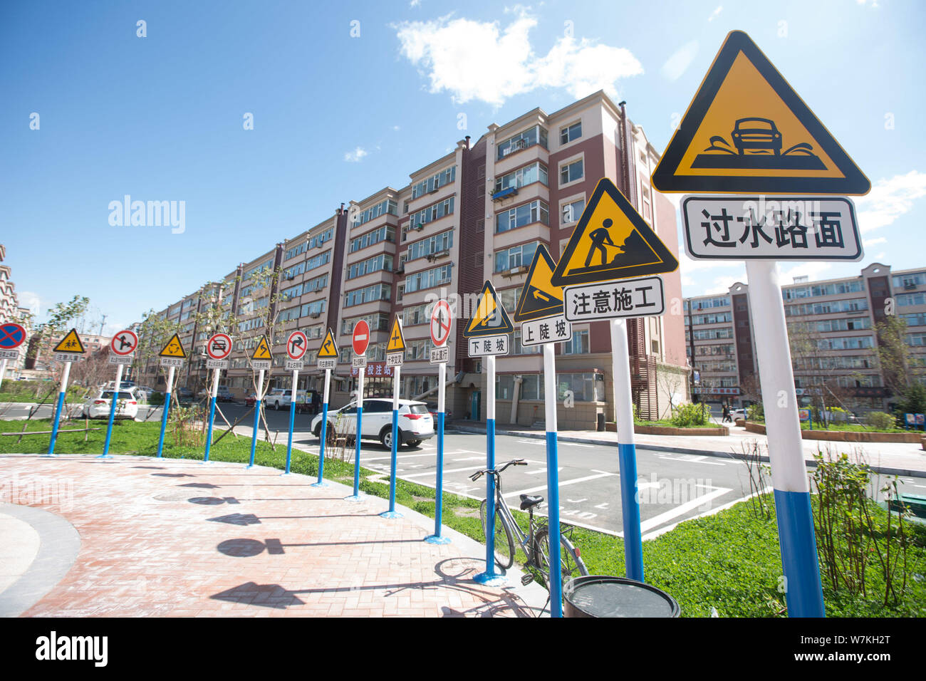 View of the road signs densely arrayed along a road at a residential ...