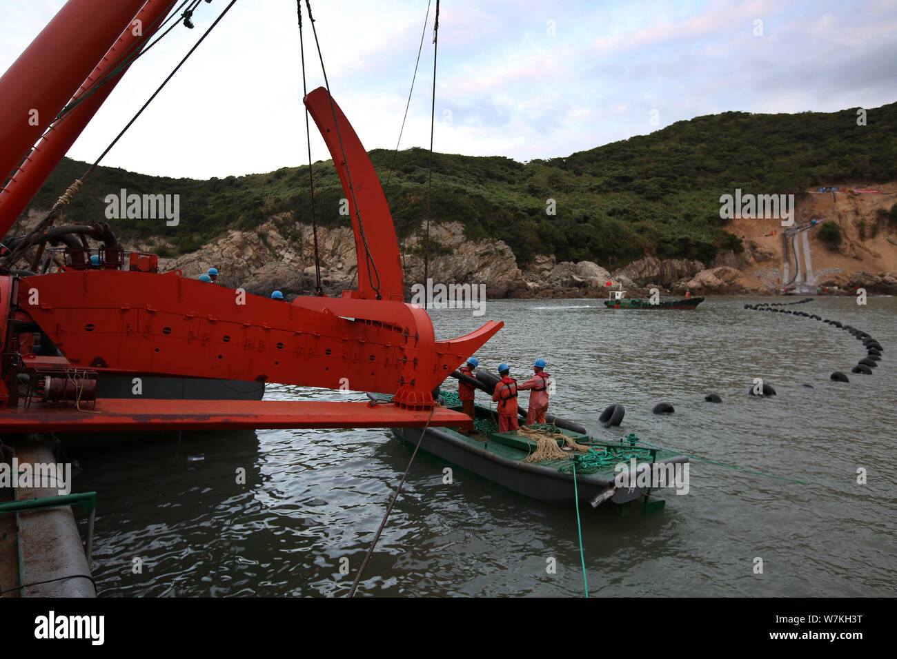 Chinese workers labor at the construction site of the 150MW Putuo No. 6 ...