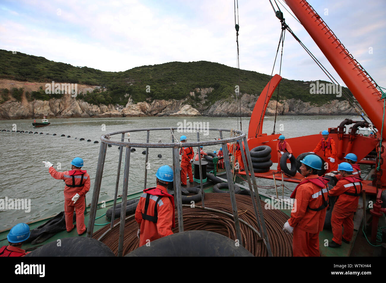 Chinese workers labor at the construction site of the 150MW Putuo No. 6 ...