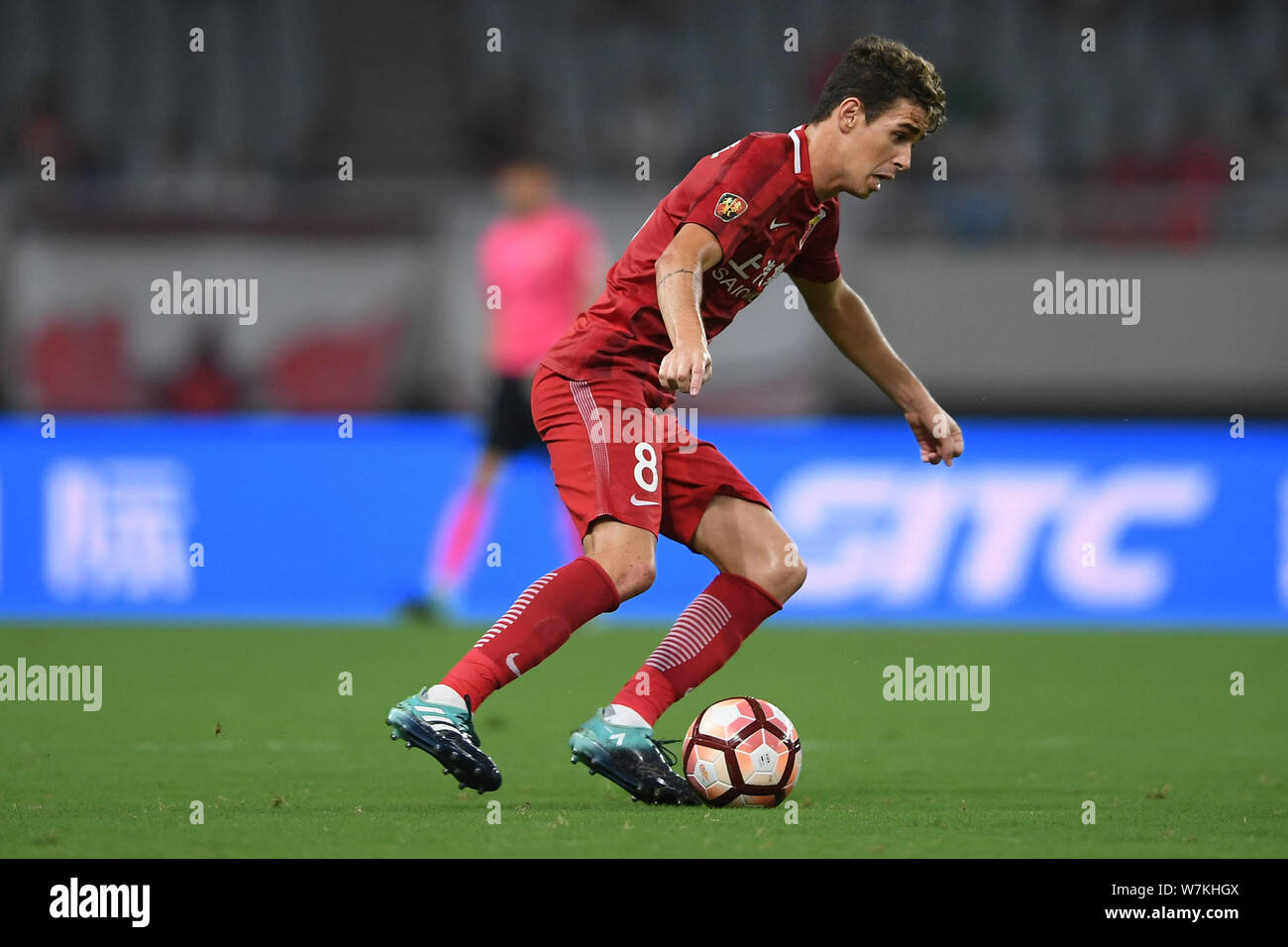 Brazilian football player Oscar of Shanghai SIPG kicks the ball to make ...