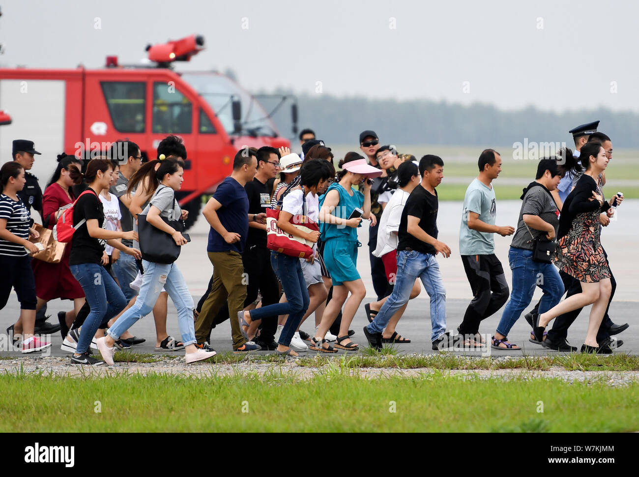 Passengers are pictured after being rescued by Chinese police officers ...