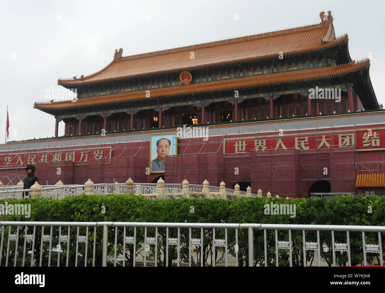 A Chinese paramilitary police officer stands guard in front of the ...