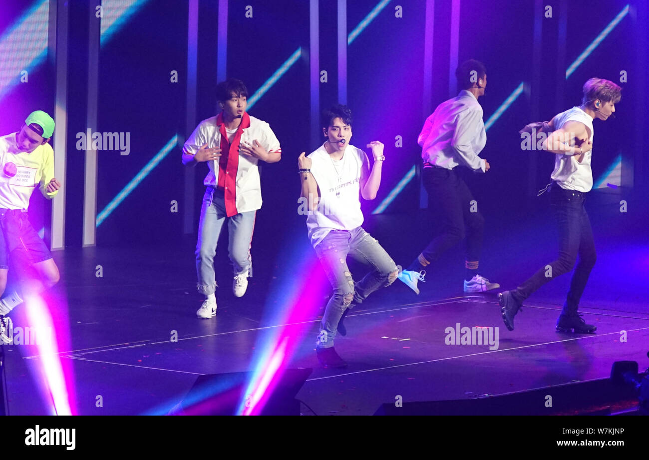 Members of South Korean boy group SHINee perform during the SMtown ...