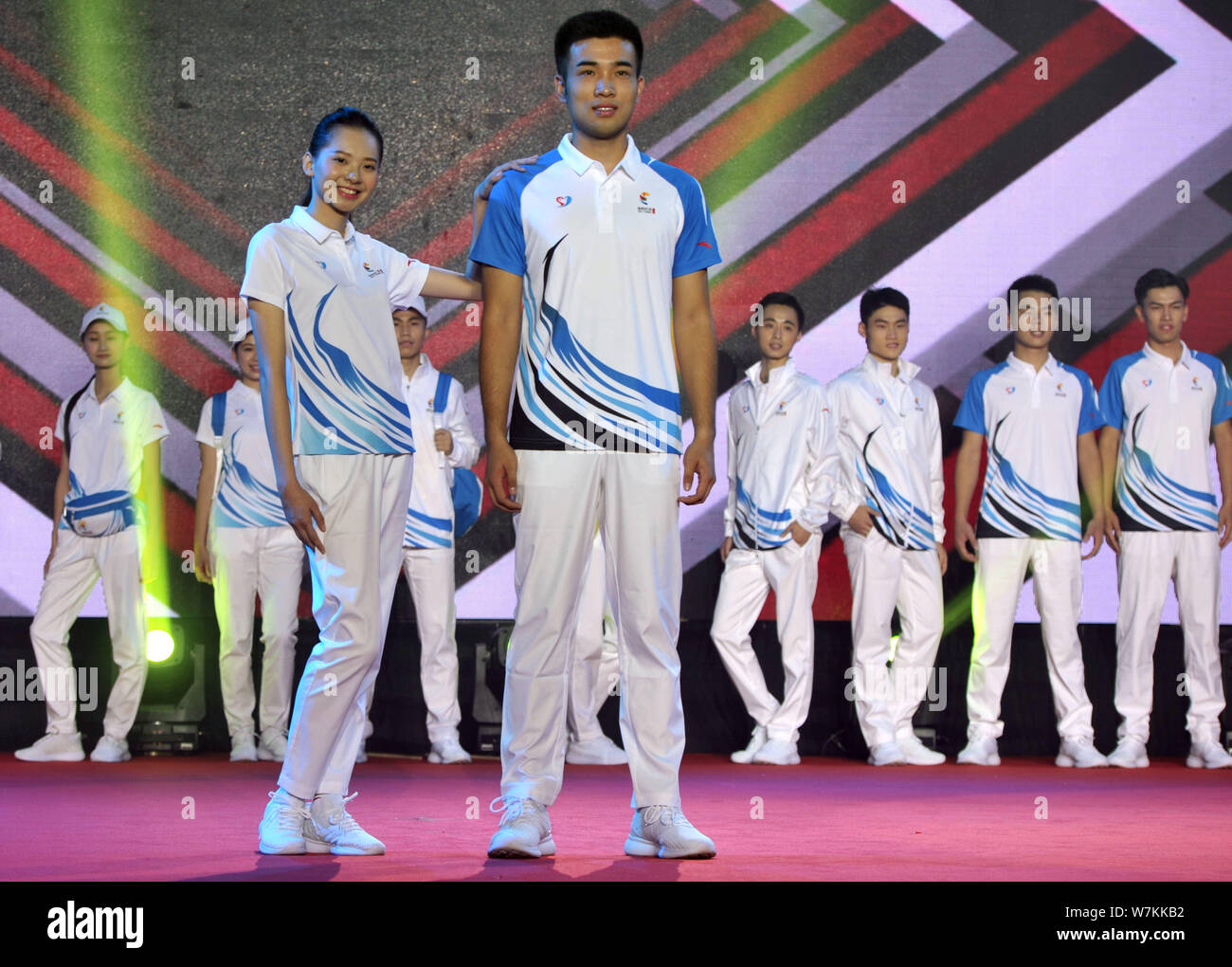 Representatives of Chinese volunteers display volunteer's uniforms for ...