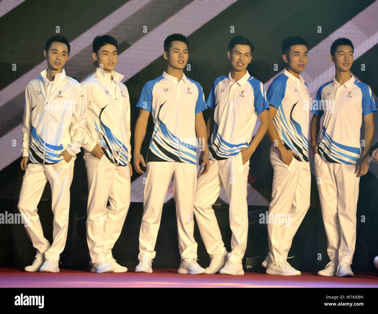 Representatives of Chinese volunteers display volunteer's uniforms for ...