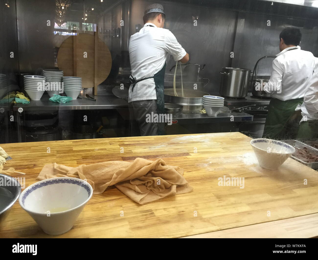 Chefs prepare Lanzhou hand-pulled noodles for customers at a Lanzhou ...