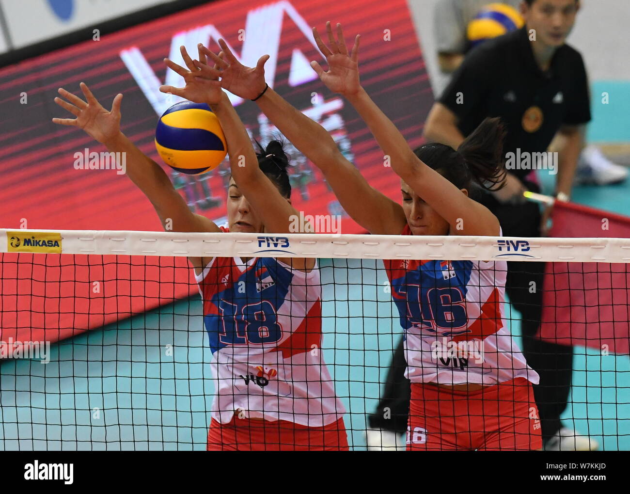 Milena Rasic, right, and Tijana Boskovic of Serbia jump to block a ...