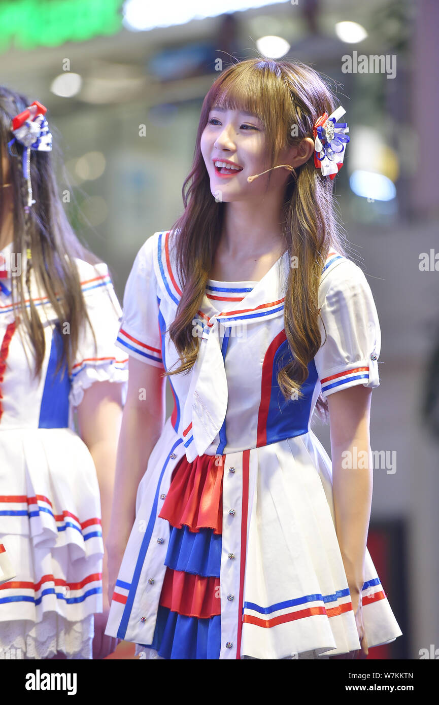 A member of Chinese idol girl group SHY48 attends a promotional event ...