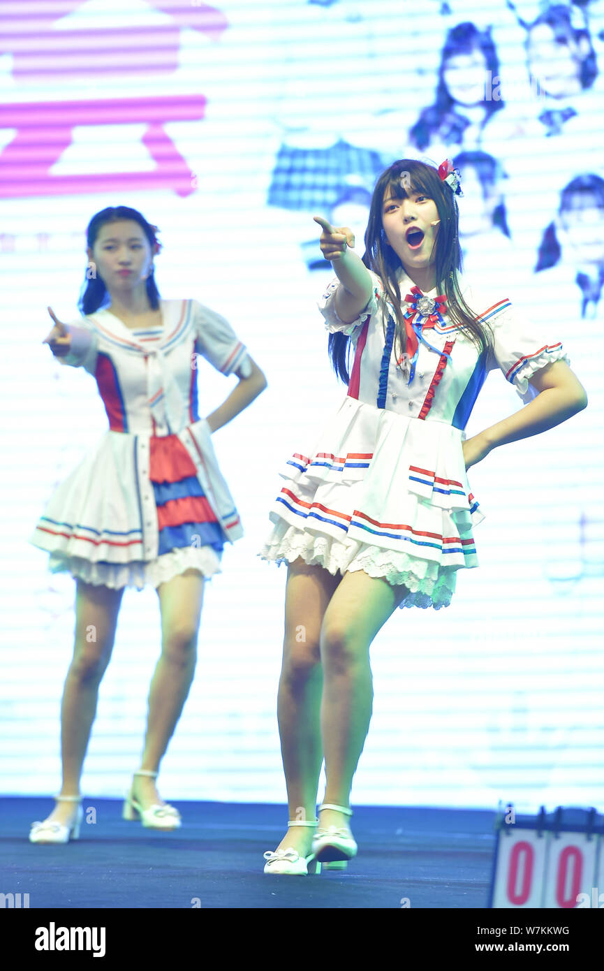 Members of Chinese idol girl group SHY48 attend a promotional event at ...