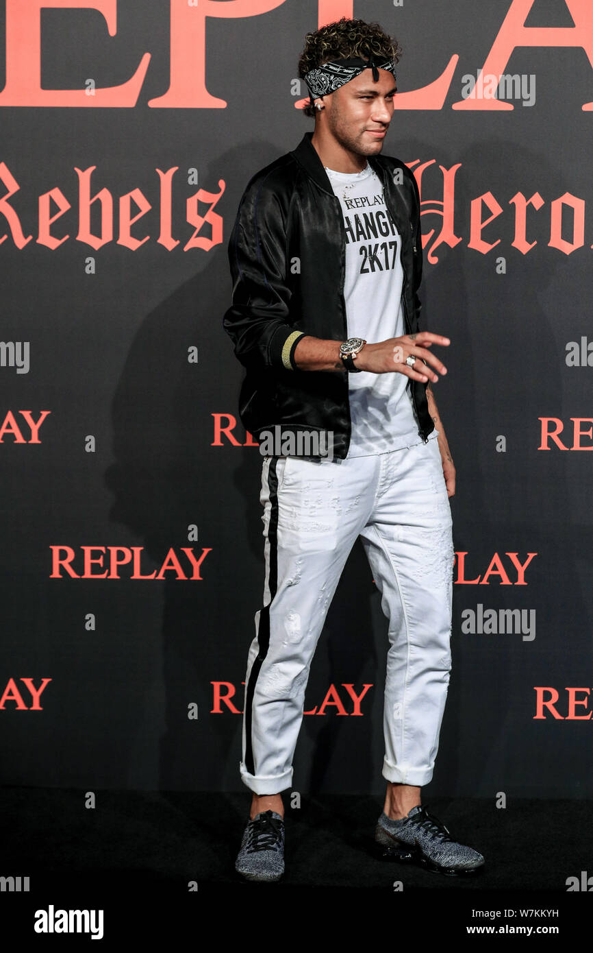 Brazilian football star Neymar, or Neymar Jr., poses as he arrives at ...