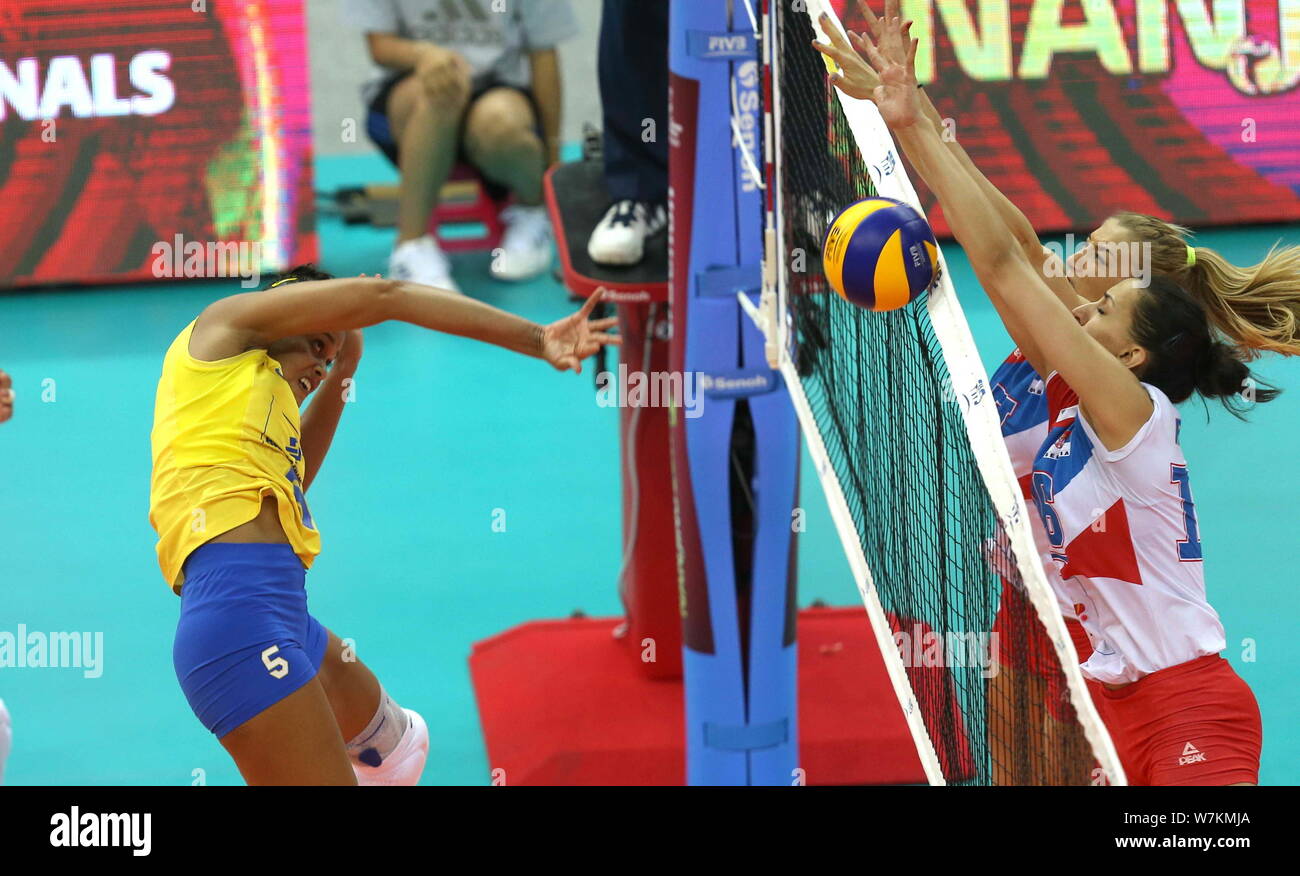 Adenizia Da Silva of Brazil spikes against Ana Antonijevic, back, and ...
