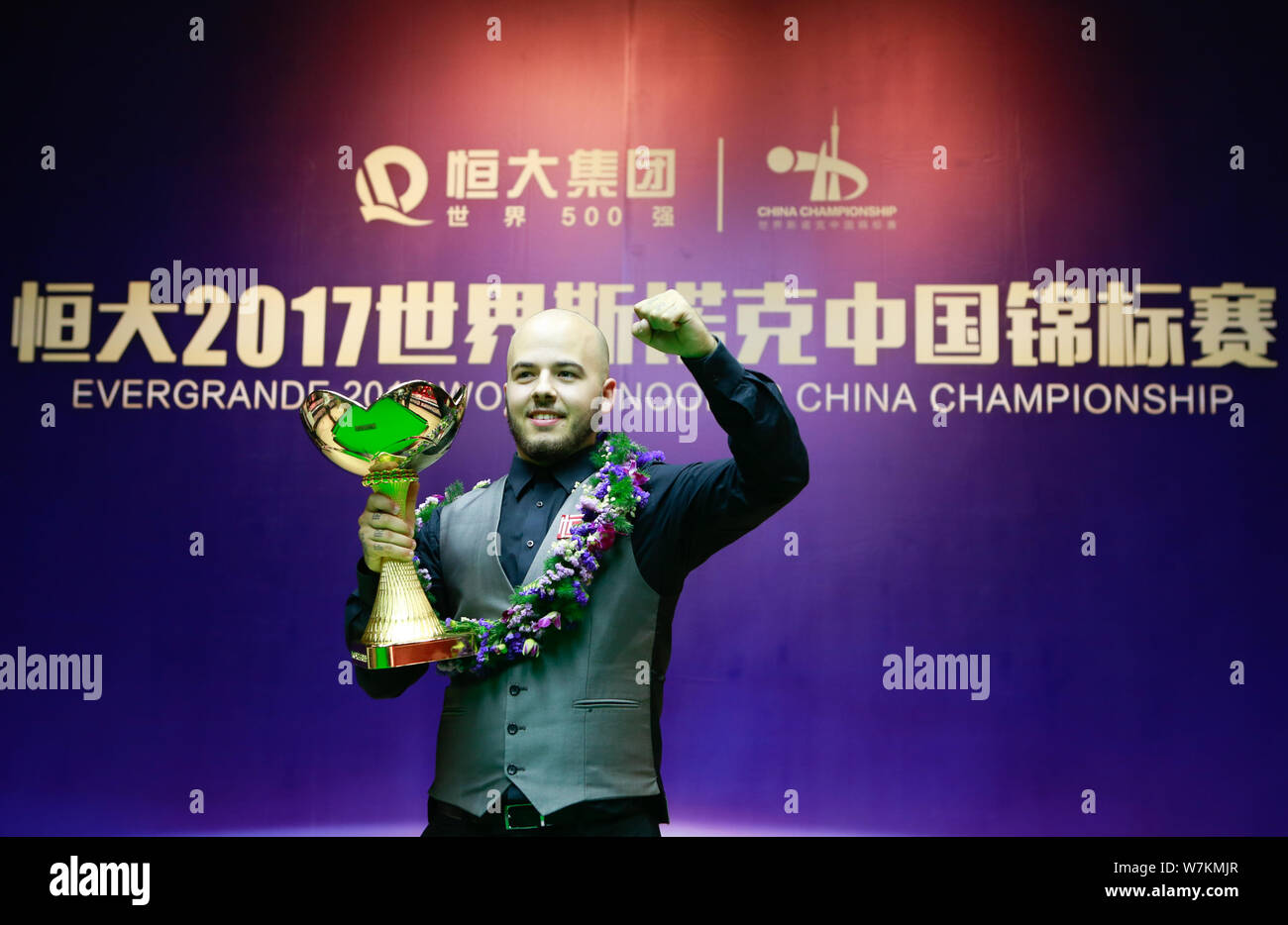 Luca Brecel of Belgium poses with trophy after defeating Shaun Murphy ...