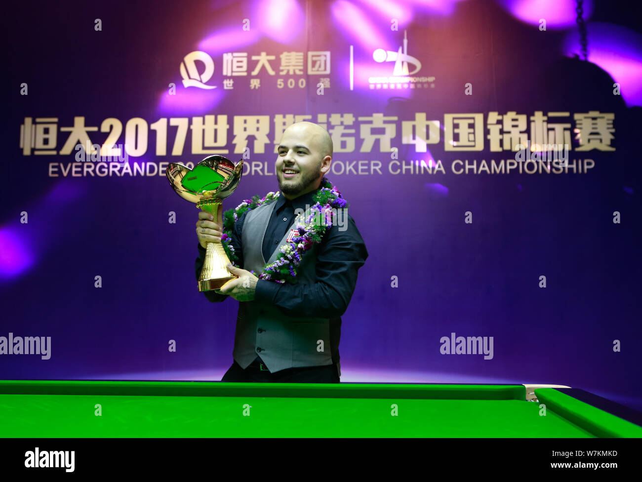 Luca Brecel of Belgium poses with trophy after defeating Shaun Murphy ...