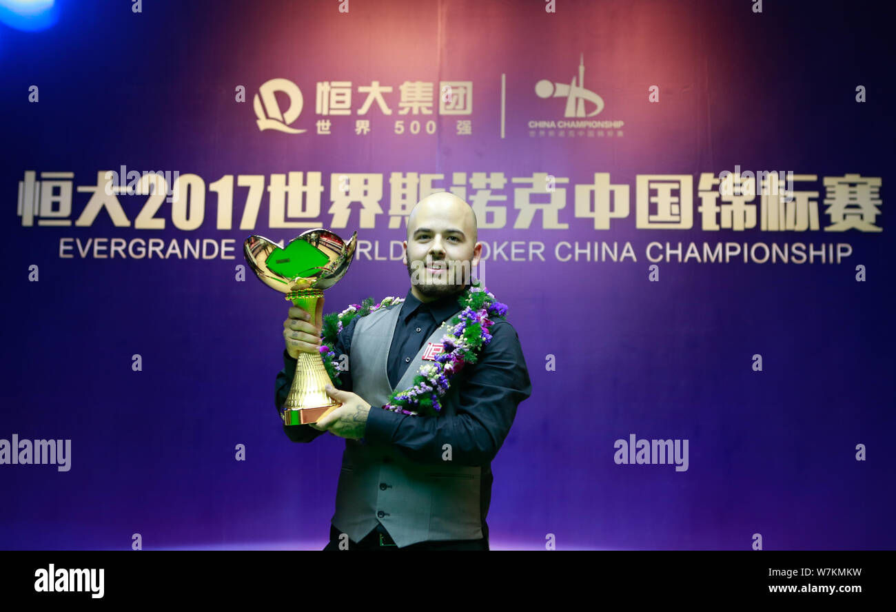 Luca Brecel of Belgium poses with trophy after defeating Shaun Murphy ...