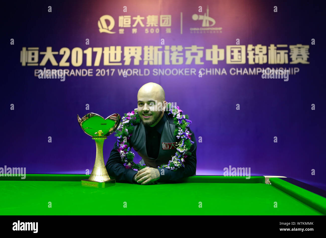 Luca Brecel of Belgium poses with trophy after defeating Shaun Murphy ...