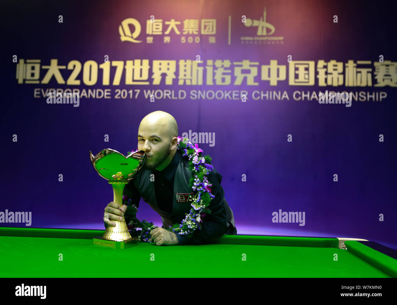 Luca Brecel of Belgium poses with trophy after defeating Shaun Murphy ...