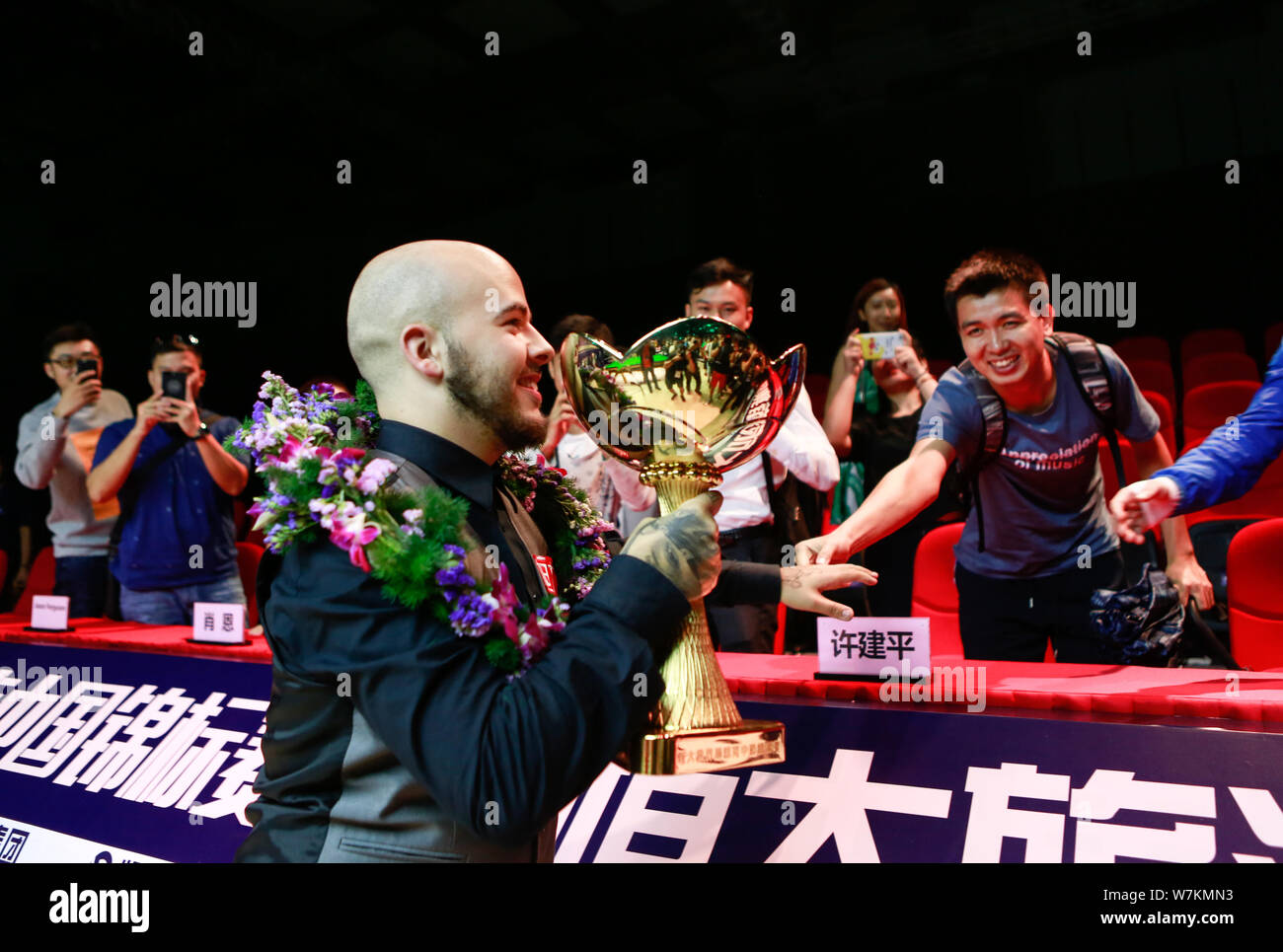 Luca Brecel of Belgium poses with trophy after defeating Shaun Murphy ...
