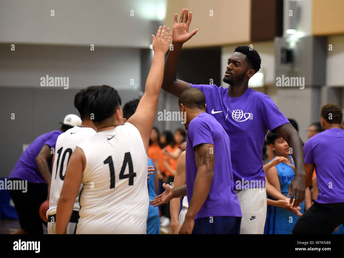 American basketball player Bobby Portis, right, visits Lam Tai Fai ...