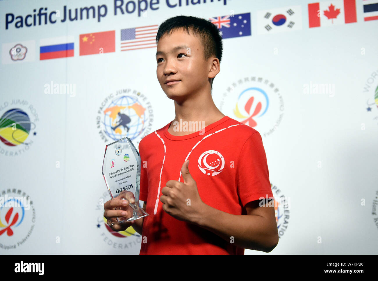 Cen Xiaolin, a 13-year-old boy from south China's Guangdong, poses with ...