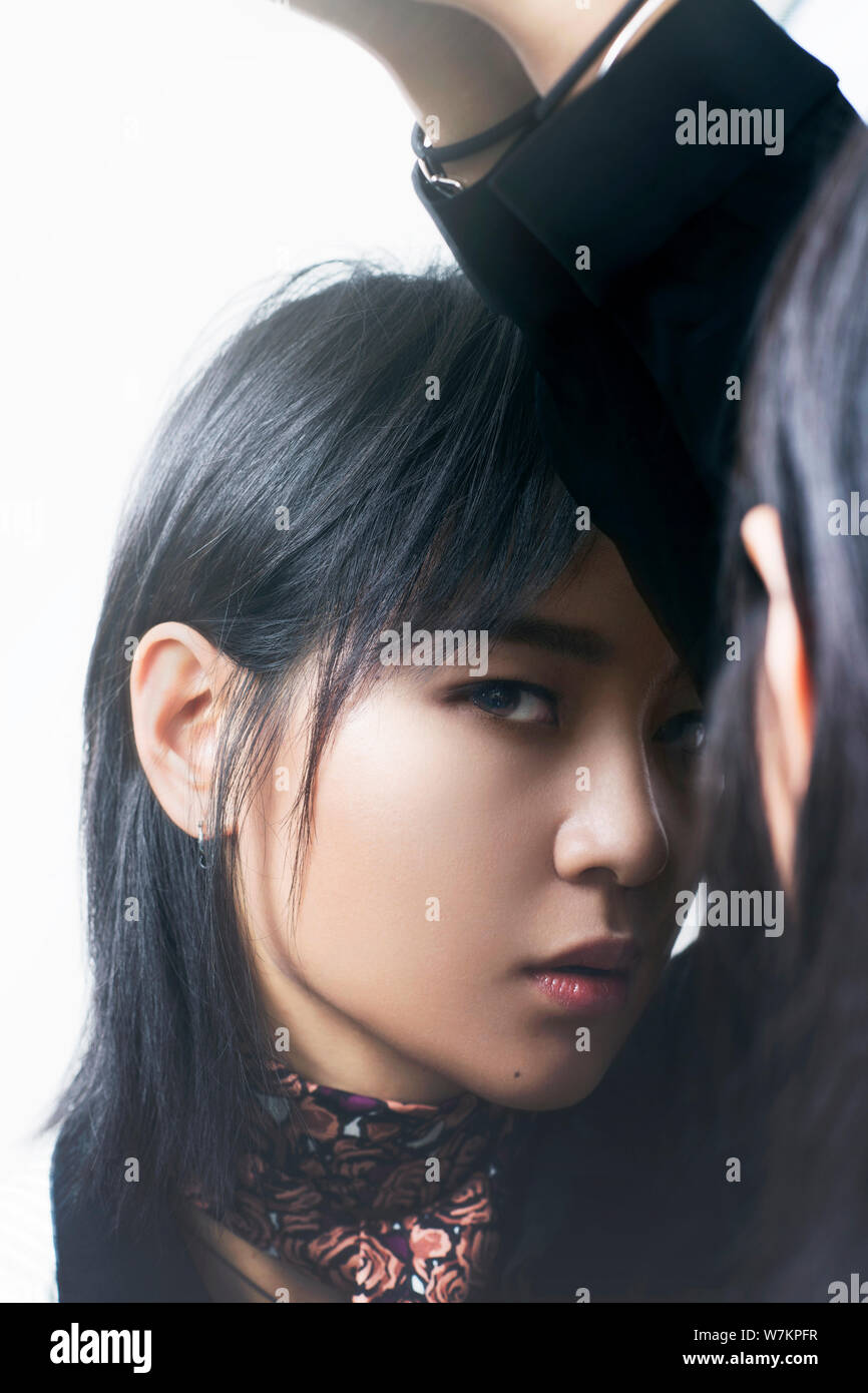 Chinese singer Zhou Bichang poses for portrait photos during an ...