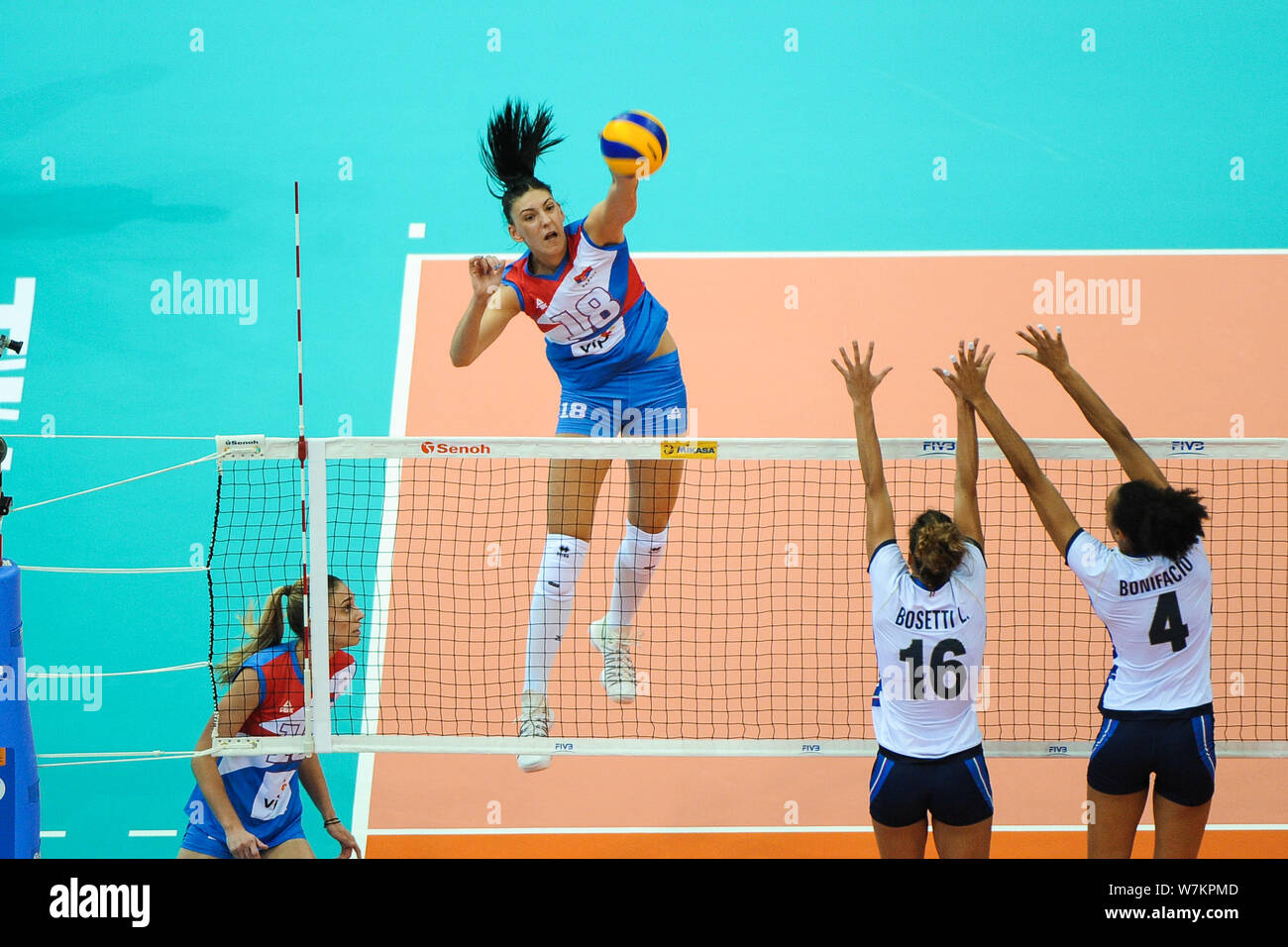 Lucia Bosetti, left, and Sara Bonifacio of Italy spike against Tijana ...