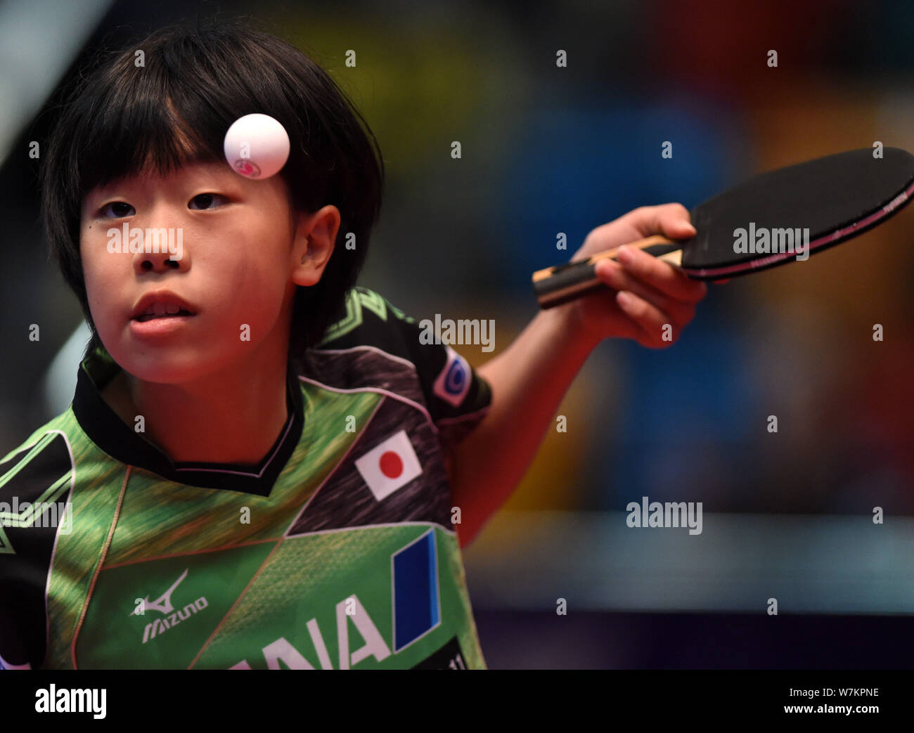 Yumoto Fuwa of Japan serves as she and Ojio Haruna compete against Ng ...