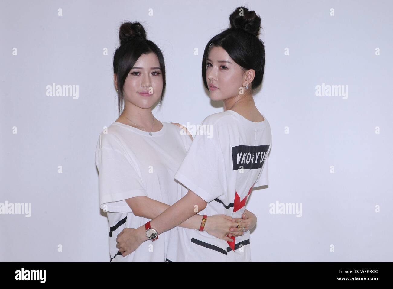 The twin sisters Miko Bai and Yumi Bai of Singaporean duo BY2 attend a ...