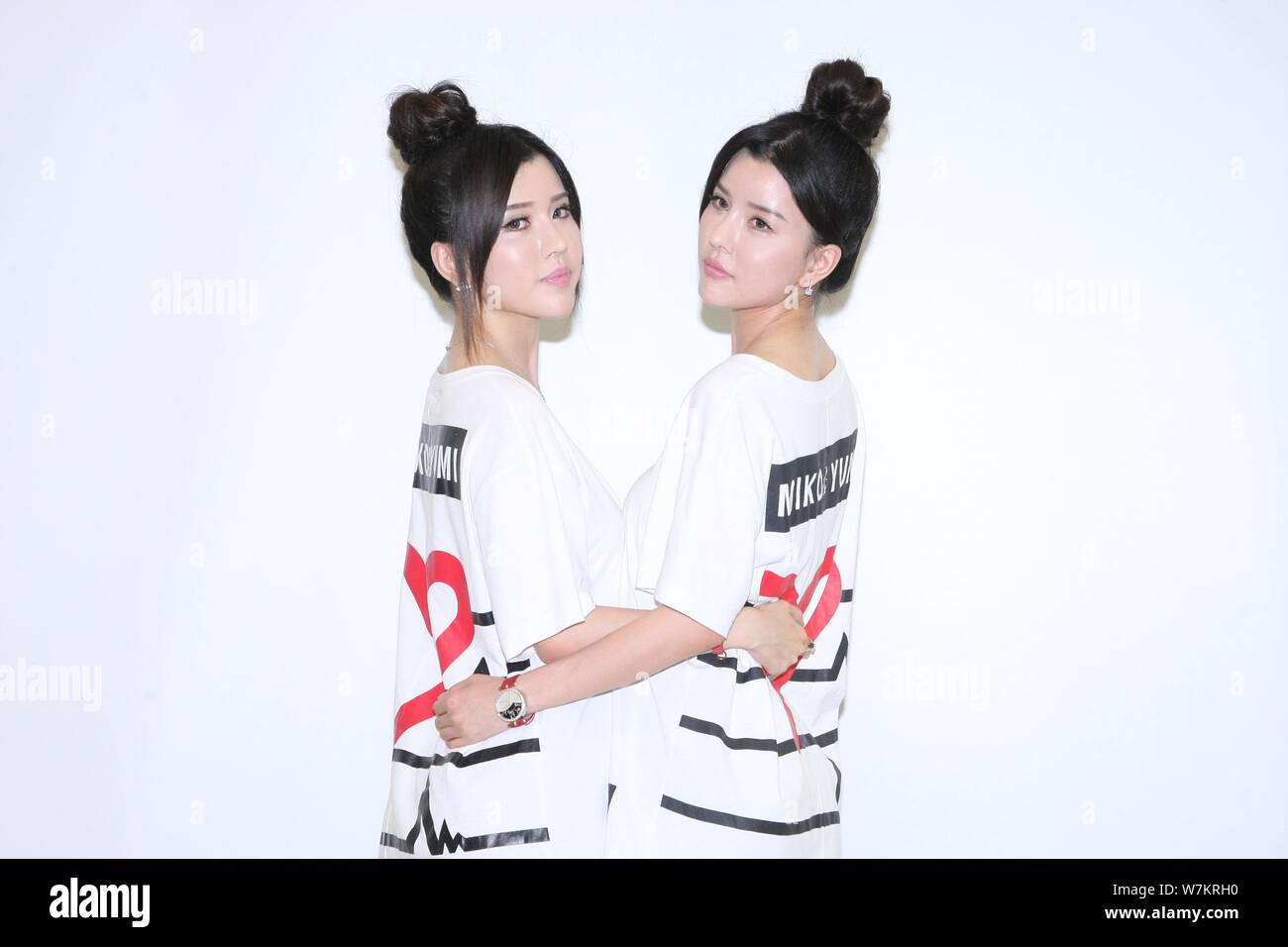 The twin sisters Miko Bai and Yumi Bai of Singaporean duo BY2 attend a thank you meeting to mark ...