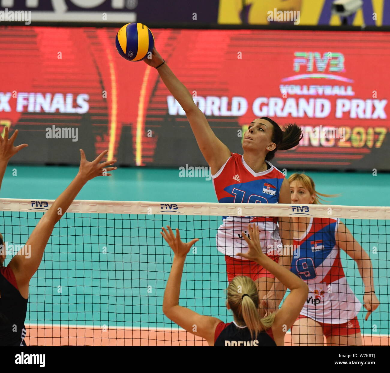 Milena Rasic, back, of Serbia spikes against USA during their match of ...