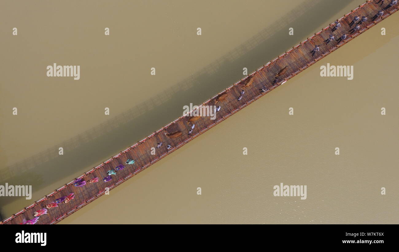 Aerial view of Chinese young people dressed in traditional costumes ...