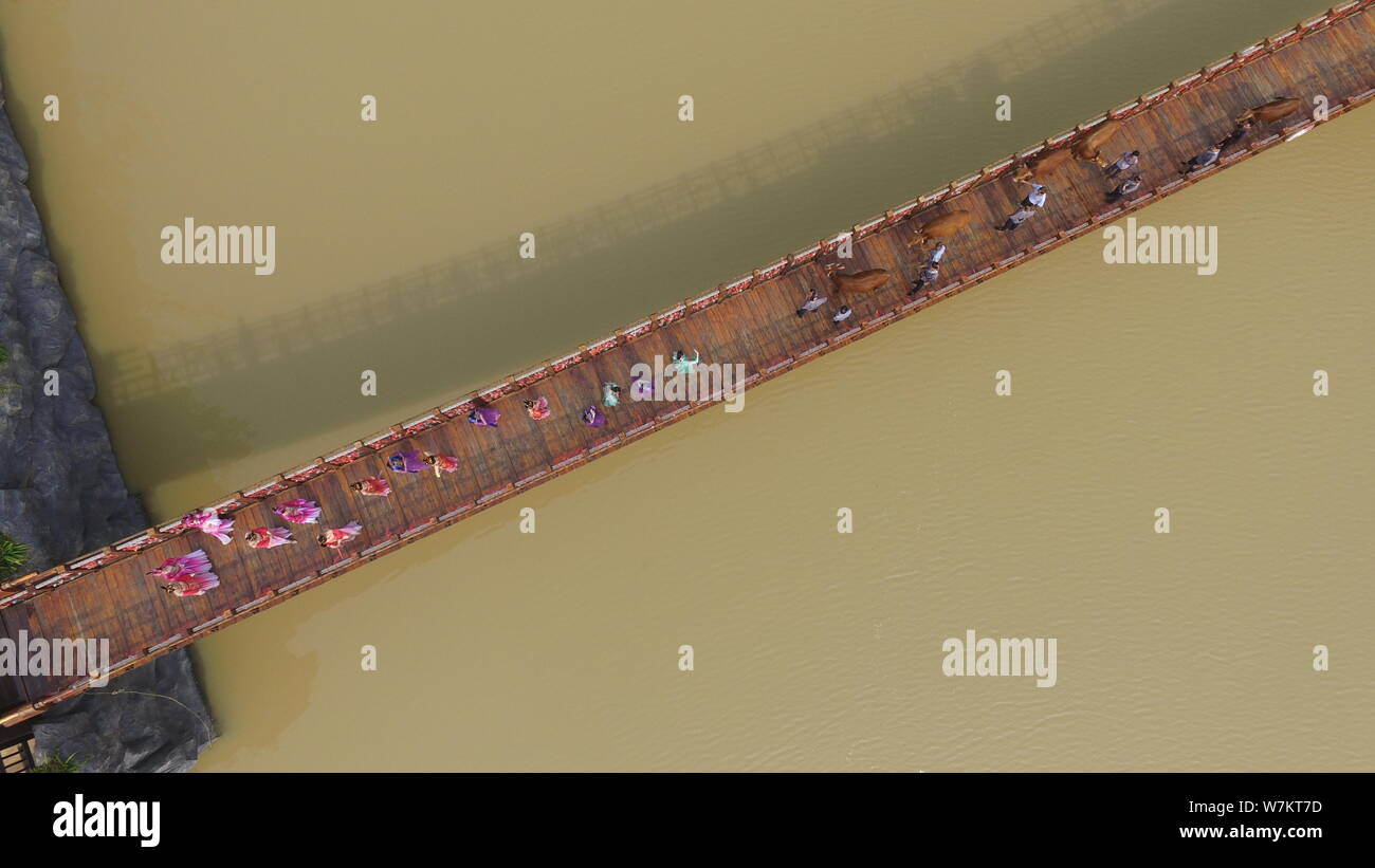 Aerial view of Chinese young people dressed in traditional costumes ...