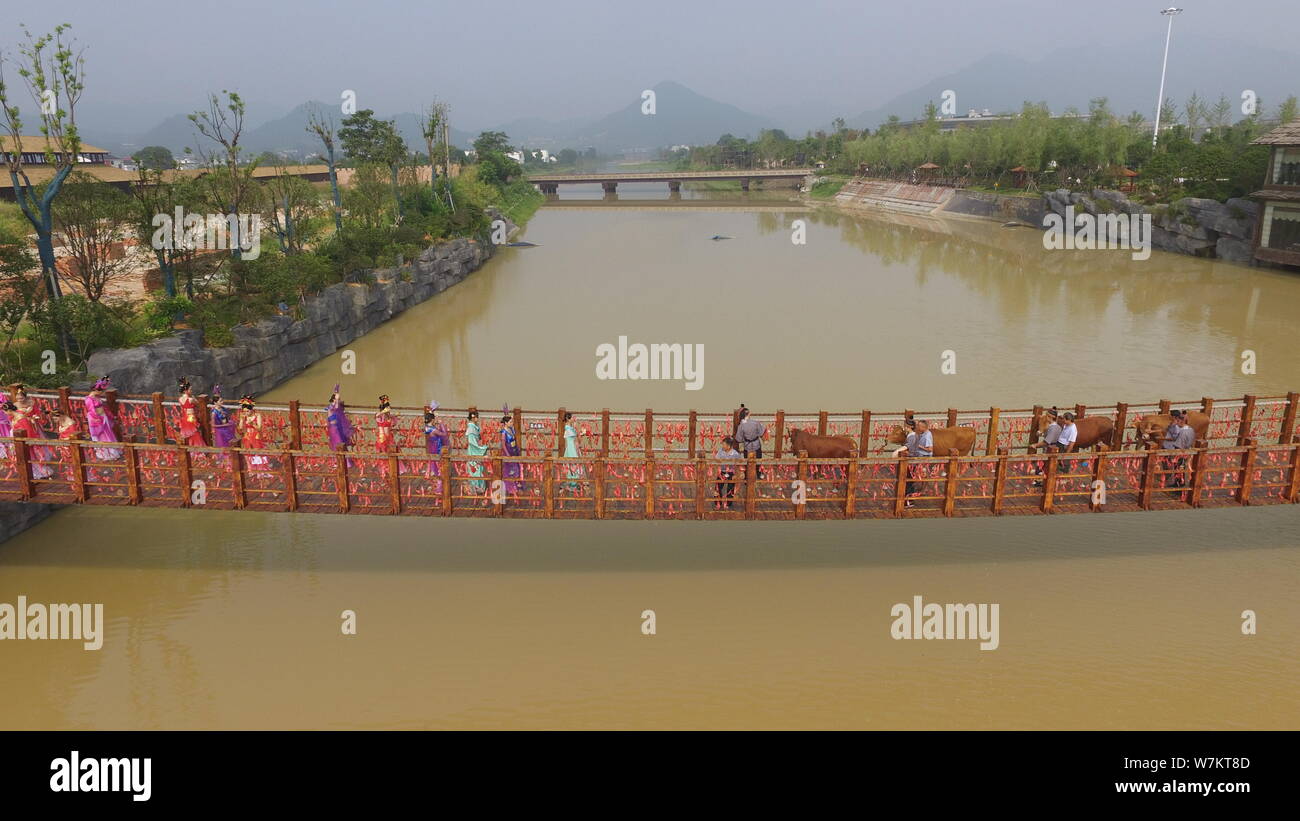 Aerial view of Chinese young people dressed in traditional costumes ...