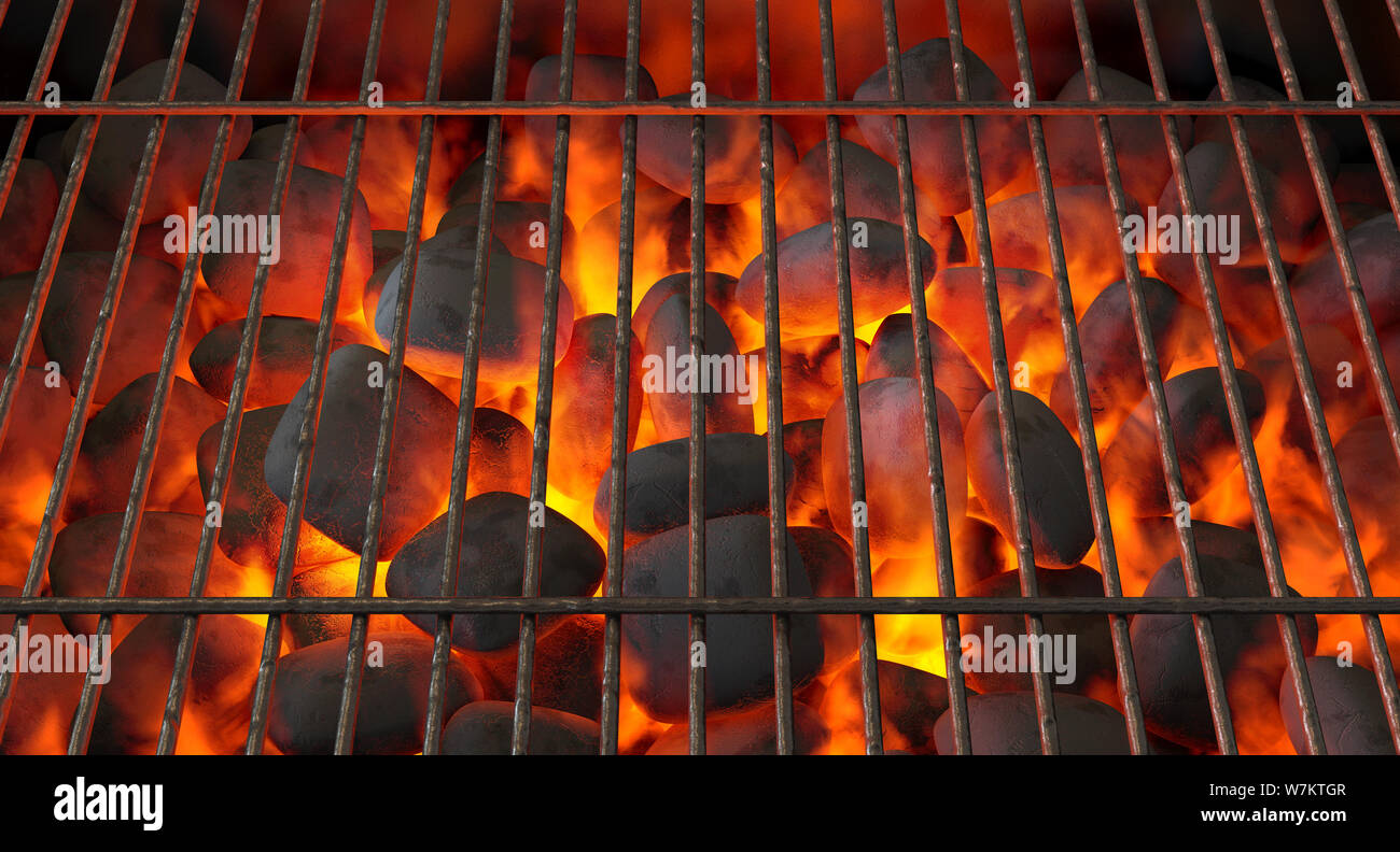 A direct top view of burning hot coal in a barbecue stand covered by a ...