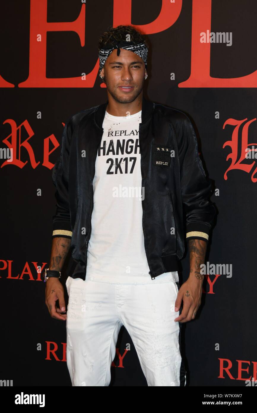 Brazilian football star Neymar, or Neymar Jr., poses as he arrives at ...