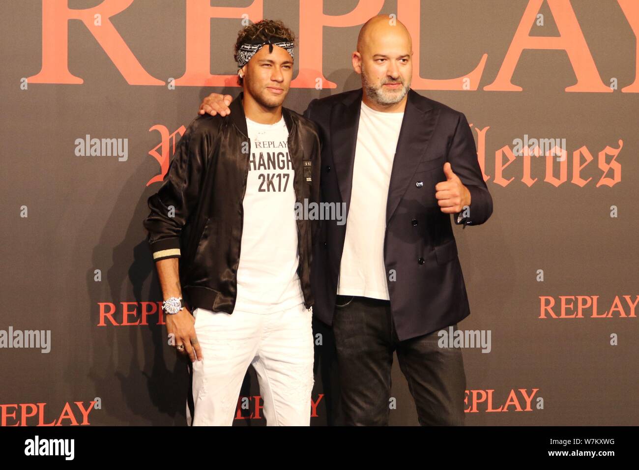 Brazilian football star Neymar, left, or Neymar Jr., poses as he ...