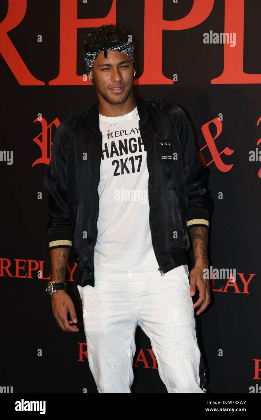 Brazilian football star Neymar, or Neymar Jr., poses as he arrives at ...