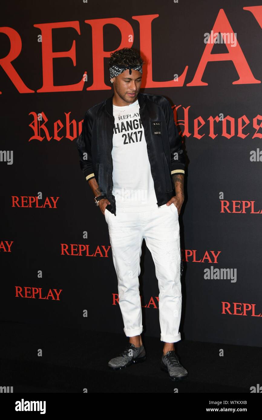 Brazilian football star Neymar, or Neymar Jr., poses as he arrives at ...