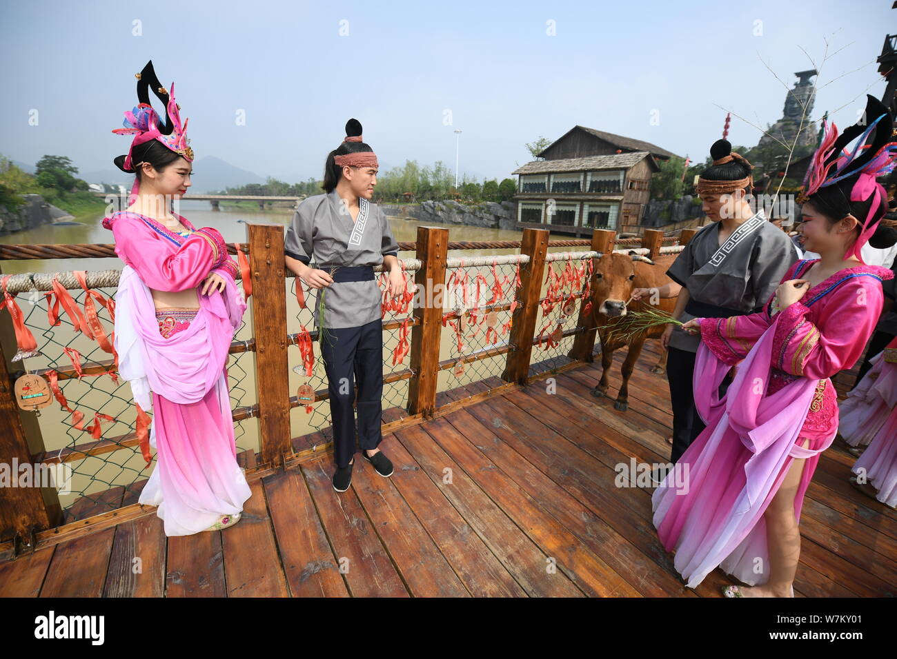 Chinese young people dressed in traditional costumes reshow the legend ...
