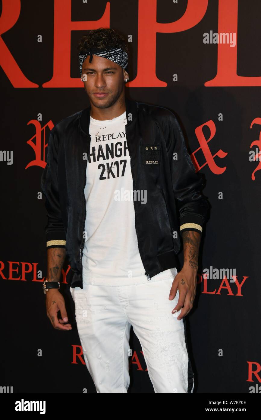 Brazilian football star Neymar, or Neymar Jr., poses as he arrives at ...