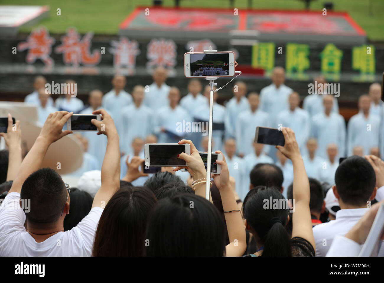 Visitors take photos of monks and nuns from the China's first ...