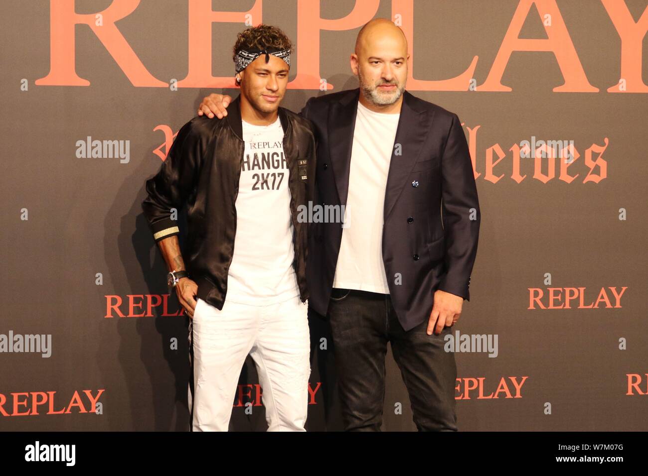 Brazilian football star Neymar, left, or Neymar Jr., poses as he ...