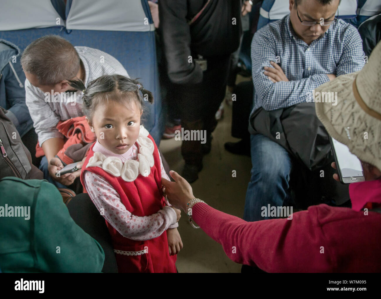 Passengers are pictured on a train running from Xining to Lhasa on the ...