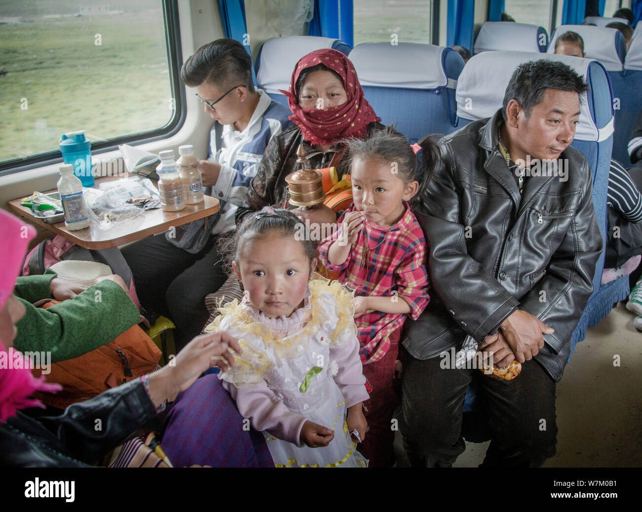 Passengers are pictured on a train running from Xining to Lhasa on the ...