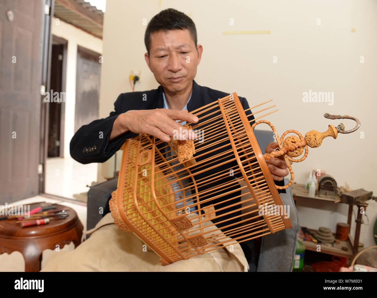 Chinese birdcage making master Yangchun makes the artwork of a birdcage ...