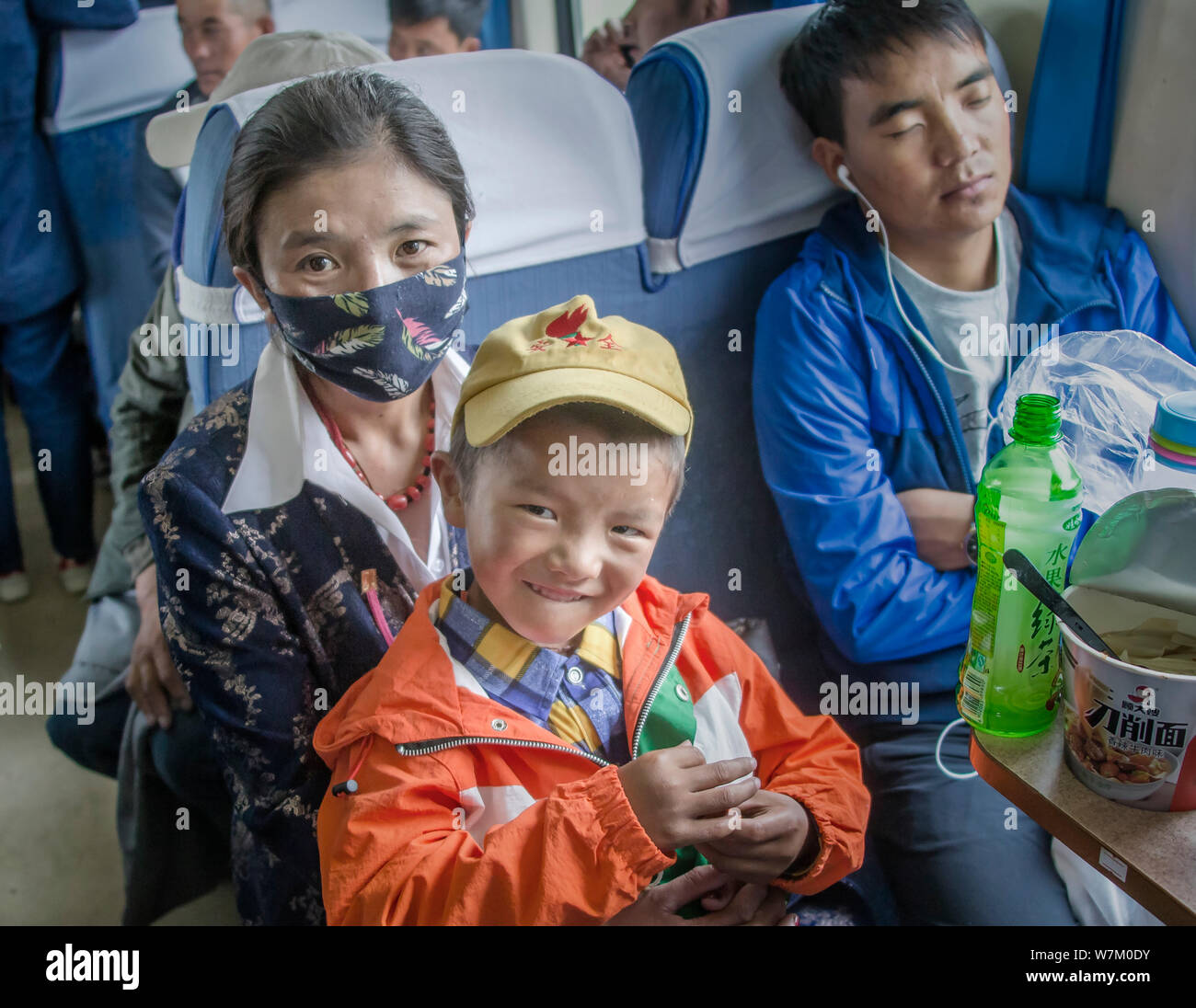 Passengers are pictured on a train running from Xining to Lhasa on the ...