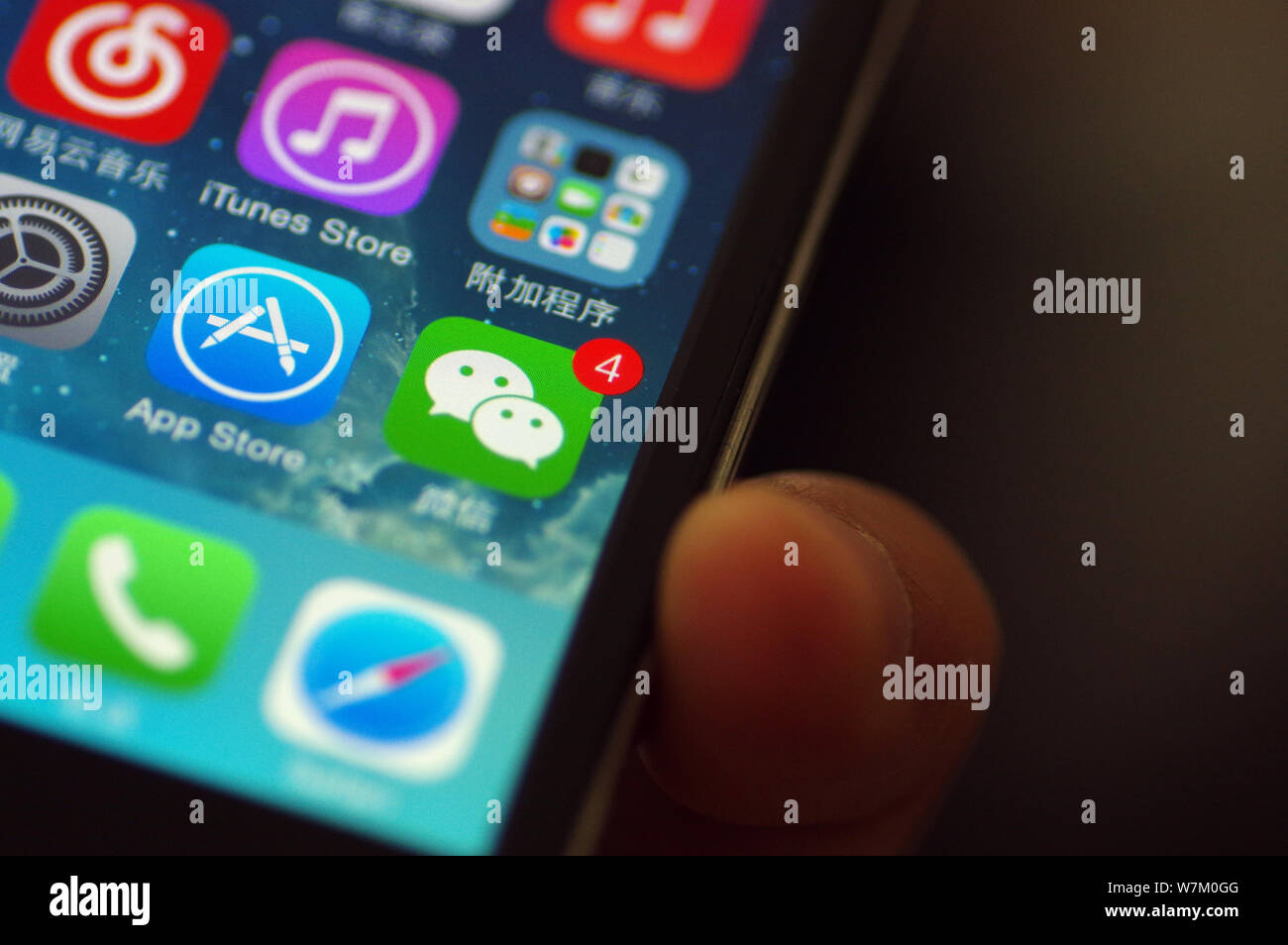 --FILE--A Chinese mobile phone user shows the icons of App Store, and ...