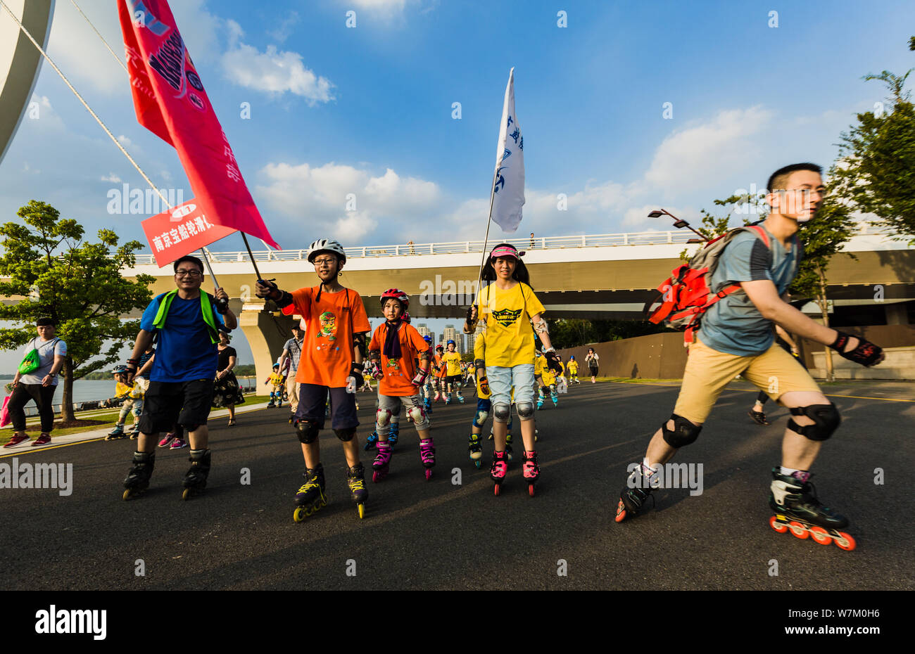 Chinese enthusiasts take part in a roller sports event to celebrate the ...